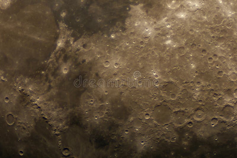 Magnified View of Moon S Cratered Surface in Golden Light Stock Image ...