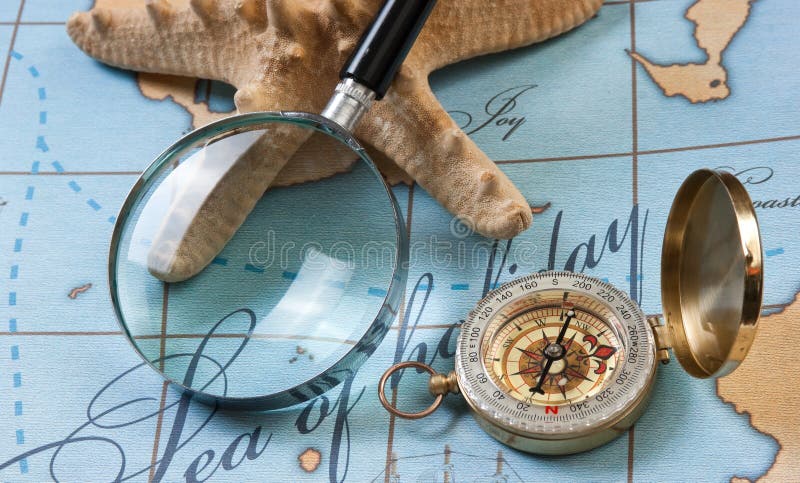 Magnifier and Compass on Map Stock Image - Image of paper, east: 142760523