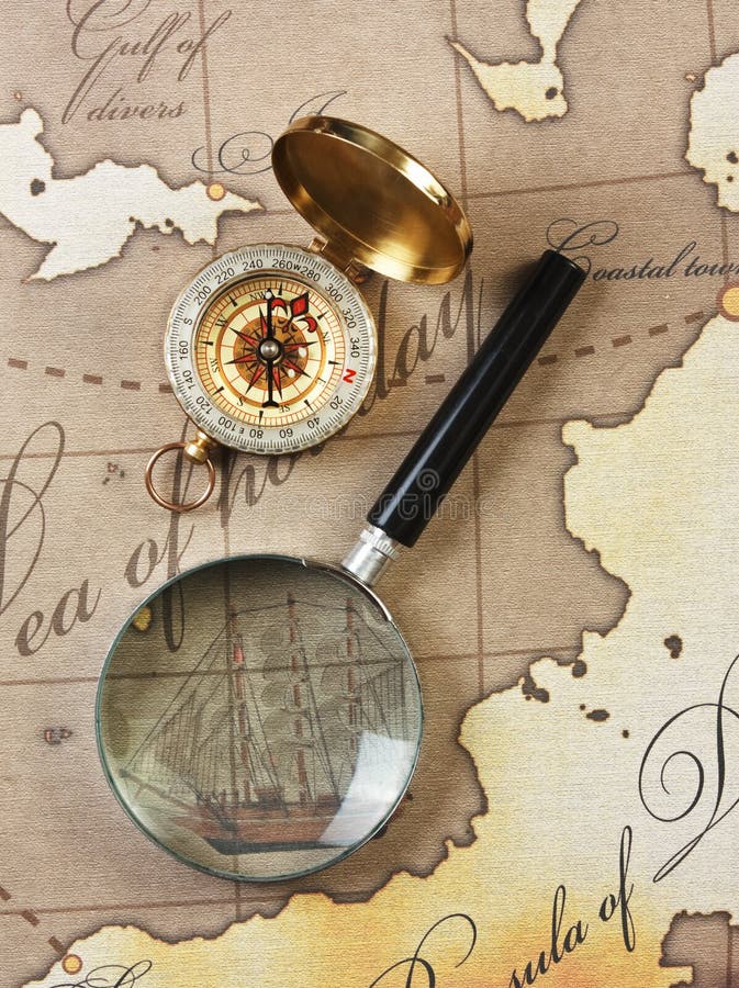 Magnifier and Compass on Map Stock Photo - Image of east, atoll: 174322108