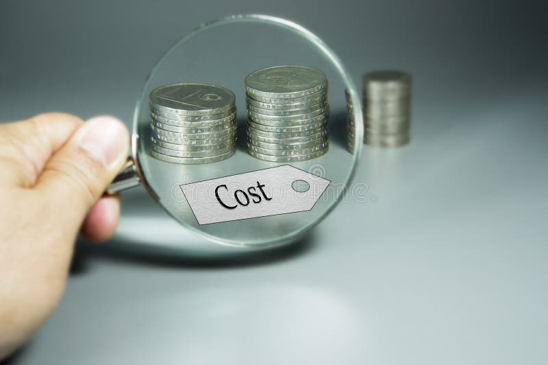 Magnifier, Cost Tag, And Stack Of Coins In The Backdround Stock Photo ...
