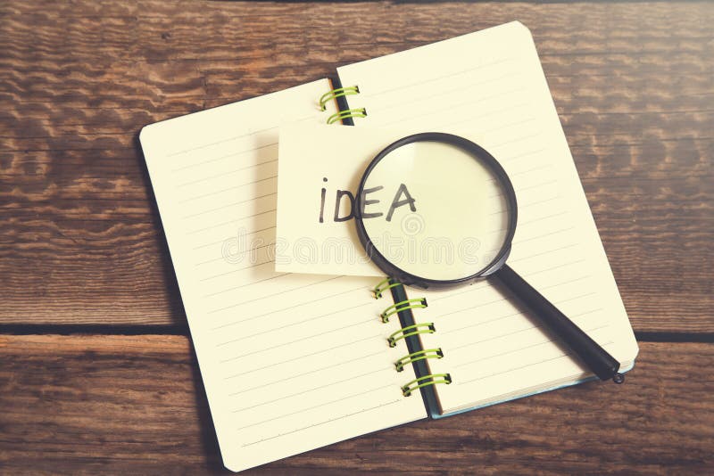Magnifier with Idea Text on Paper on Desk Stock Photo - Image of ...