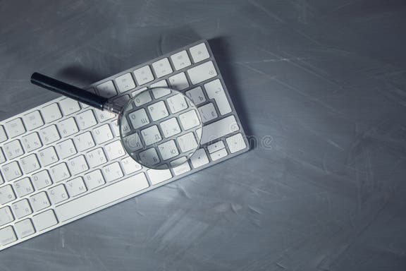 Magnifier on the keyboard stock photo. Image of business - 255828756