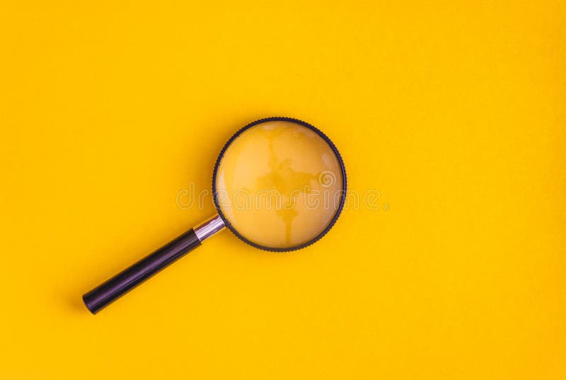 Magnifier Lies on Yellow and Blue Background. View from Above. Flat Lay ...
