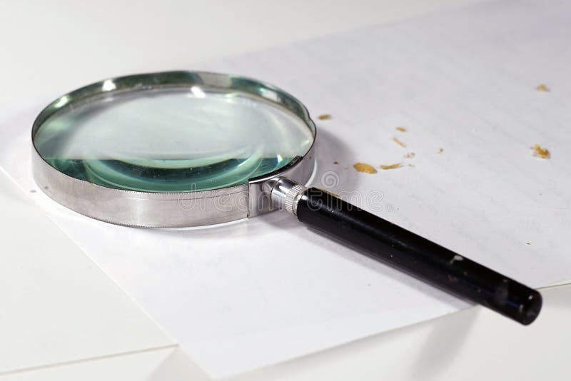 Magnifier Lying on the White Sheet of Paper Stock Image - Image of ...