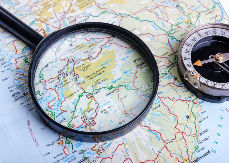 Magnifier on the Map and Compass Stock Image - Image of compass, city ...