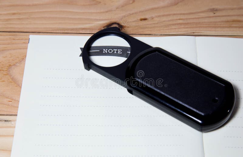 Magnifier and note book stock image. Image of page, detective - 74707175