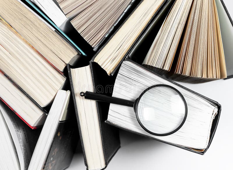 Magnifier Over Open Paper Book. Concept of Knowledge, Research and ...