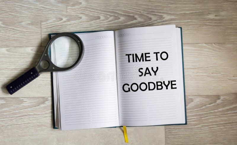 Magnifier and Phrase Time To Say Goodbye Written on a Notepad, Top View ...