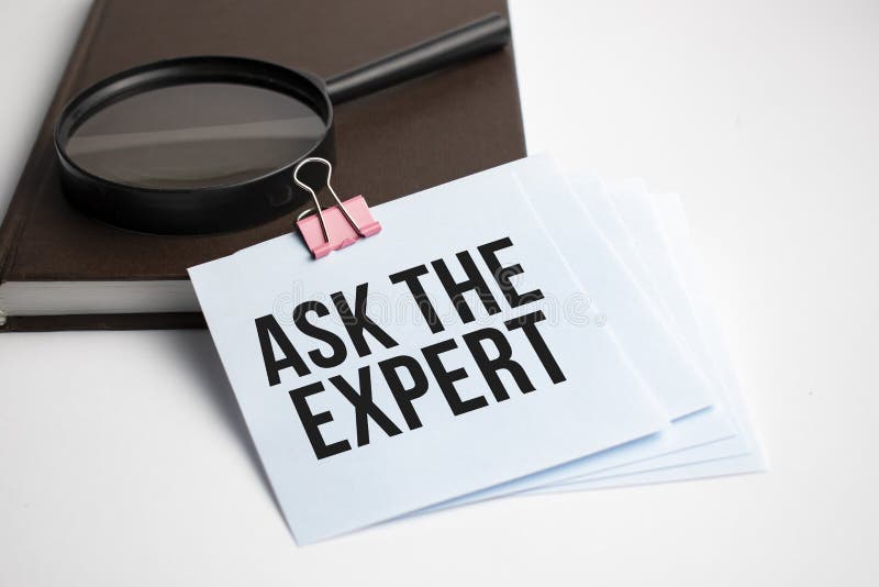 Magnifying Glass with Ask the Expert Sign on the Paper Sheet Stock ...