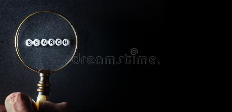 Magnifying Glass on Black Background Looking at Word Search Stock Photo ...