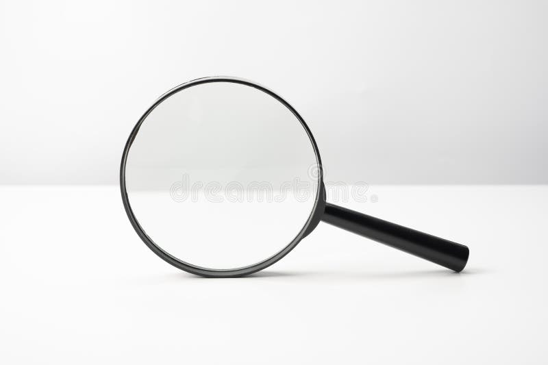 Magnifying Glass Black Color on White Table. Research, Searching or ...