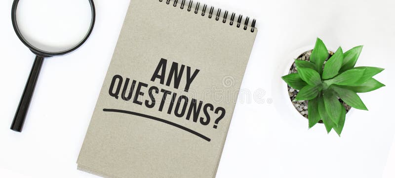 A Magnifying Glass, a Blank Brown Notebook on a White Table. ANY ...