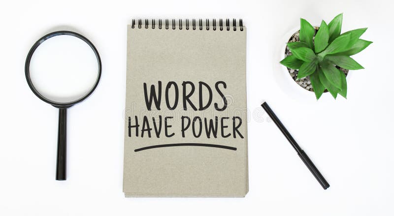A Magnifying Glass, a Blank Brown Notebook on a White Table. Words Have ...