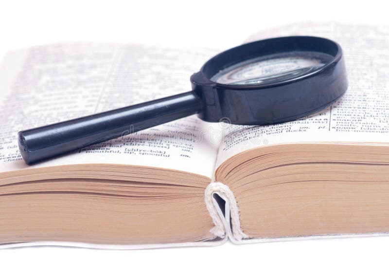 Magnifying Glass on a Book. Stock Image - Image of macro, focus: 5990099