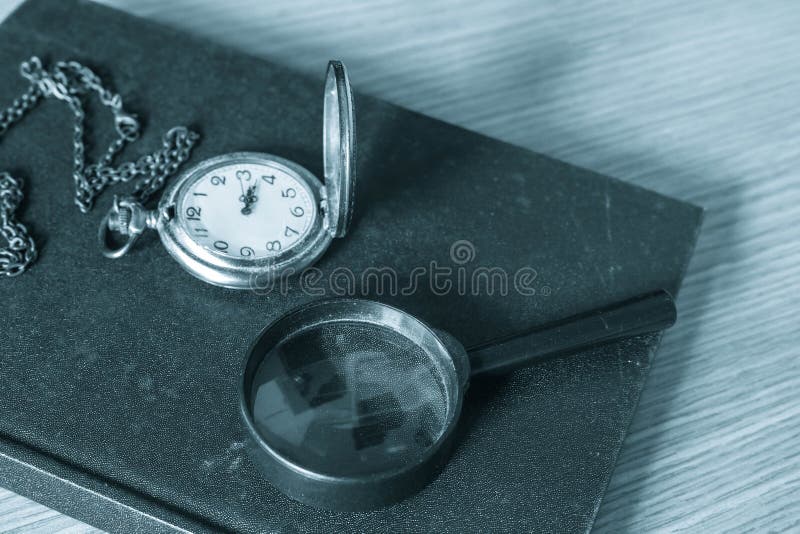 Magnifying Glass on the Books. Stock Photo - Image of antique, folder ...