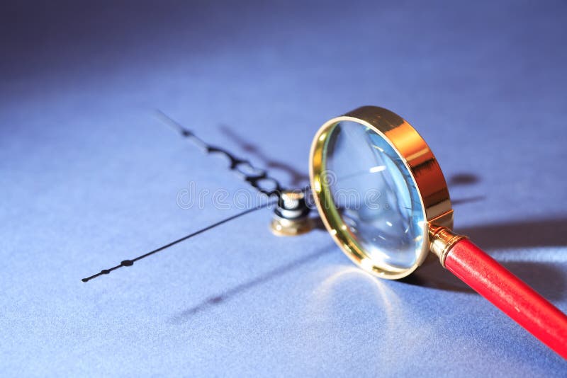 Magnifying Glass and Clock stock photo. Image of glass - 63861120