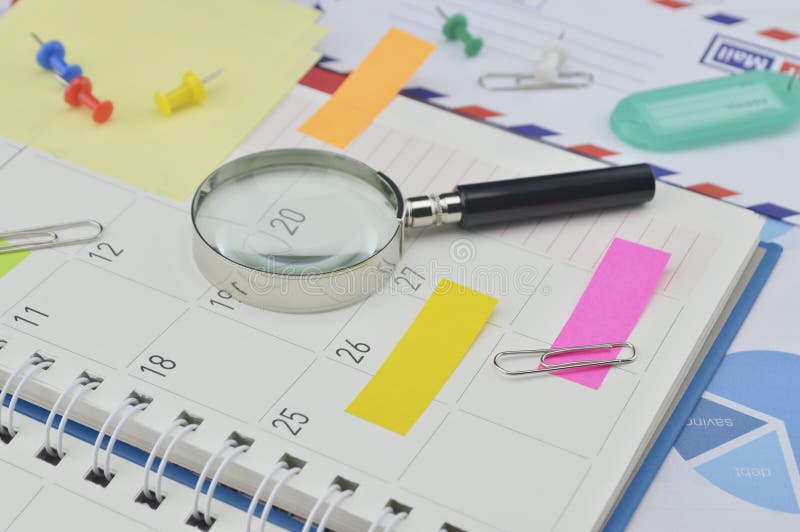 Magnifying Glass with Colorful Post it Notes and Pin on Diary Pa Stock ...