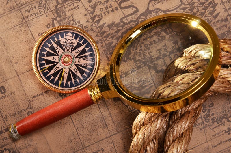 Magnifying Glass and Compass on the Ancient Map Stock Photo - Image of ...