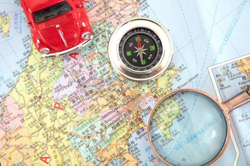 Magnifying Glass and Compass on Map and Car Model Stock Image - Image ...