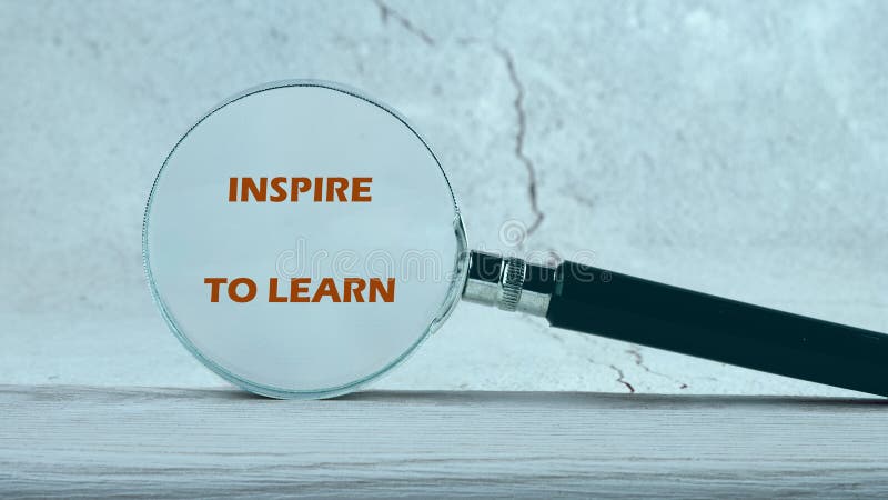 A Magnifying Glass Emphasizes the Phrase Inspire To Learn Against a ...