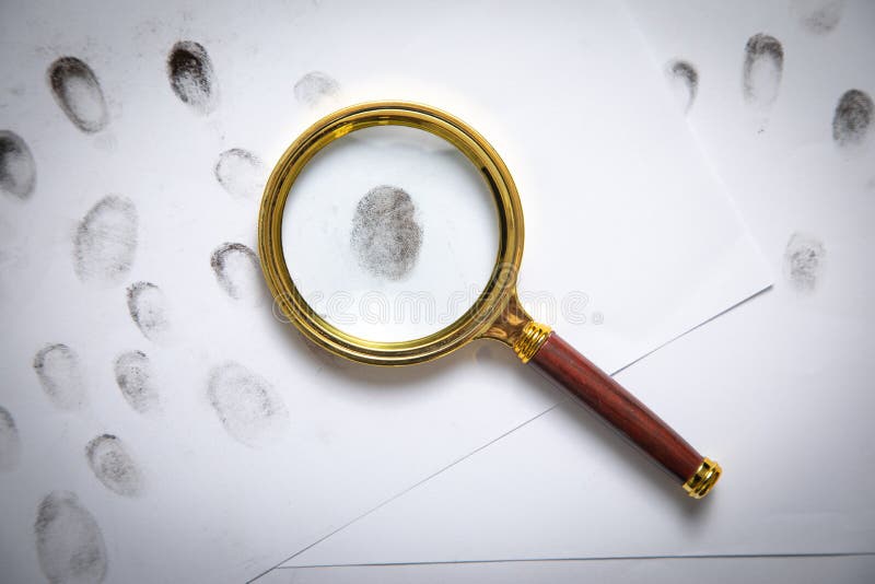 Magnifying Glass and Fingerprints. Detective Stock Photo - Image of ...