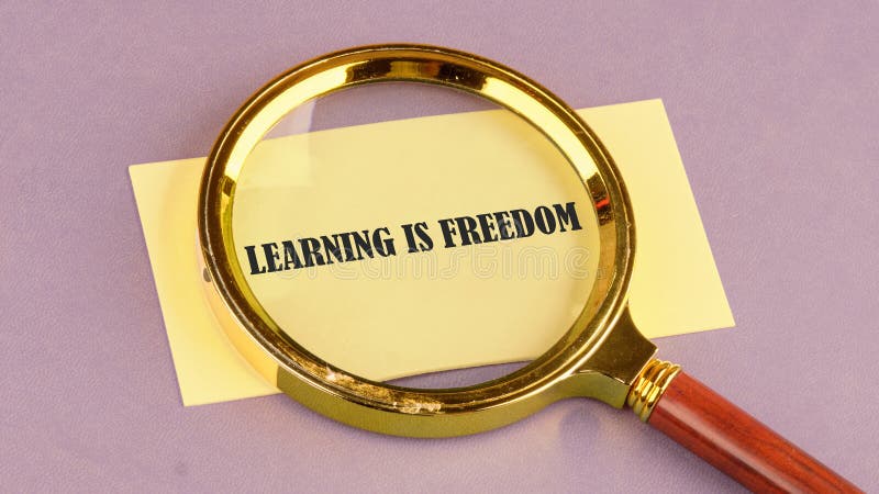 A Magnifying Glass Focuses on a Note Stating that Learning is Freedom ...