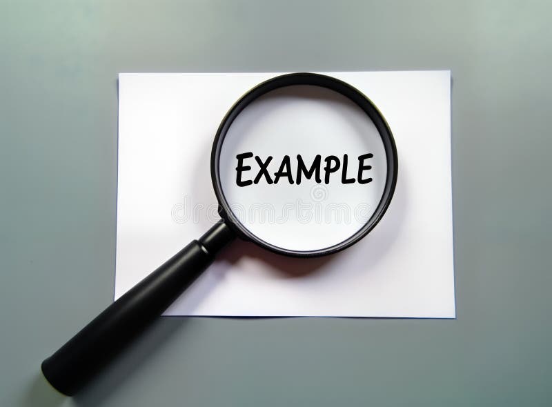 Magnifying Glass Focuses on Word Example on White Paper. Study or ...
