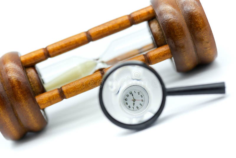 Magnifying Glass Focusing of Sandglass, Hourglass with Clock. Stock ...