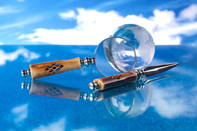 Magnifying Glass Globe and Knife Stock Photo - Image of globe, gold ...