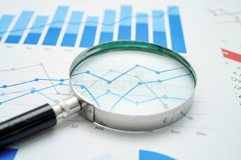Magnifying Glass on Graph. Finance Business and Trading Stock Photo ...