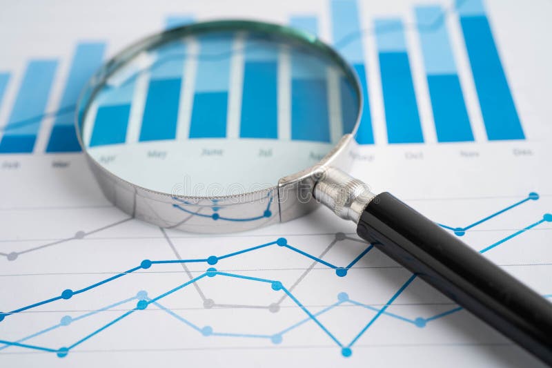 Magnifying Glass on Graph. Finance Business and Trading Stock Image ...