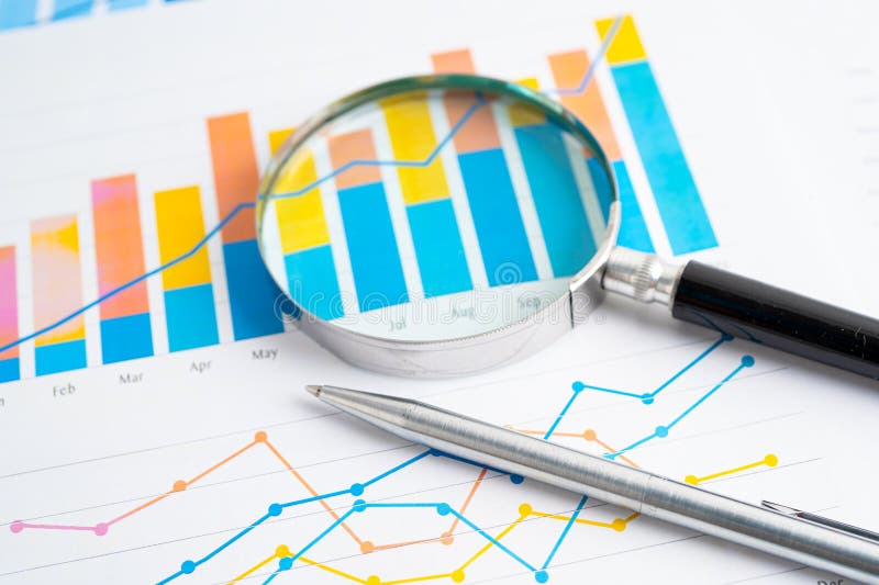 Magnifying Glass on Graph. Finance Business and Trading Stock Photo ...