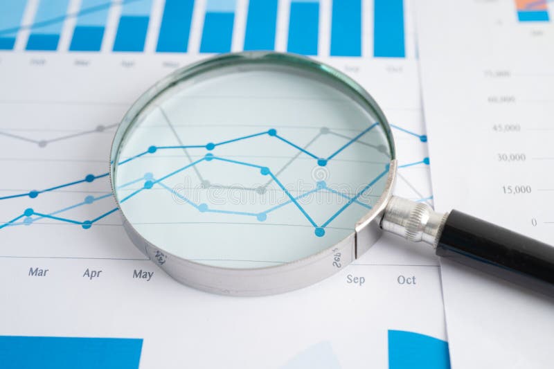 Magnifying Glass on Graph. Finance Business and Trading Stock Photo ...