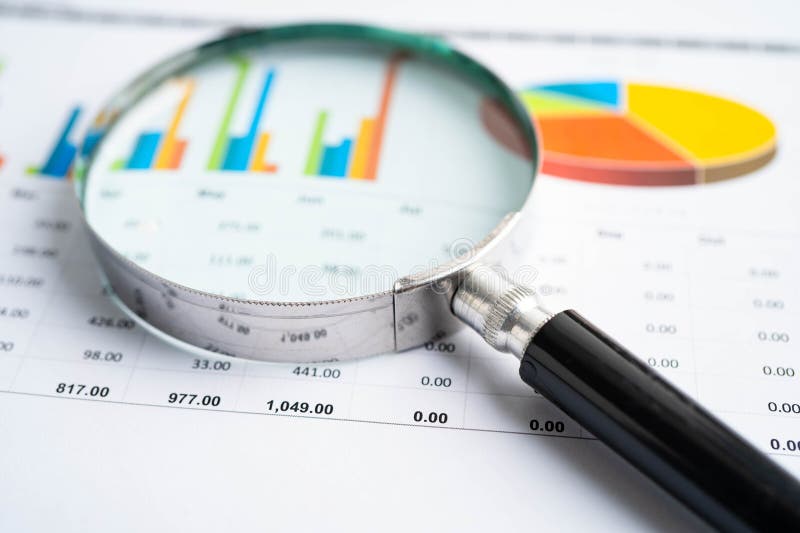 Magnifying Glass on Graph. Finance Business and Trading Stock Photo ...