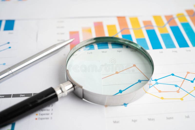 Magnifying Glass on Graph. Finance Business and Trading Stock Photo ...