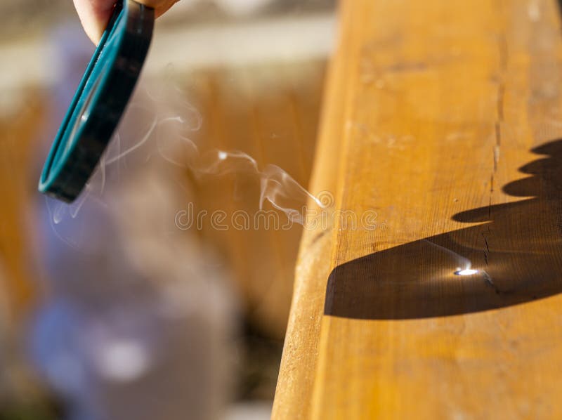 A Magnifying Glass in the Hands of a Man Who Teaches a Child To Make a ...