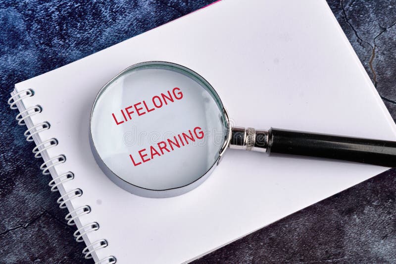 A Magnifying Glass Highlights the Phrase Lifelong Learning on a Notepad ...