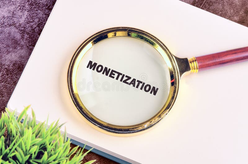 A Magnifying Glass Highlights the Word Monetization Placed on a Closed ...