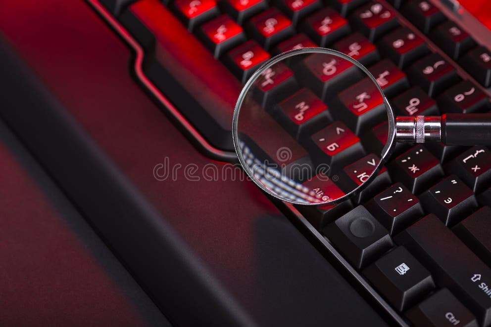 Magnifying Glass on the Keys of a Black Computer Keyboard Stock Image ...
