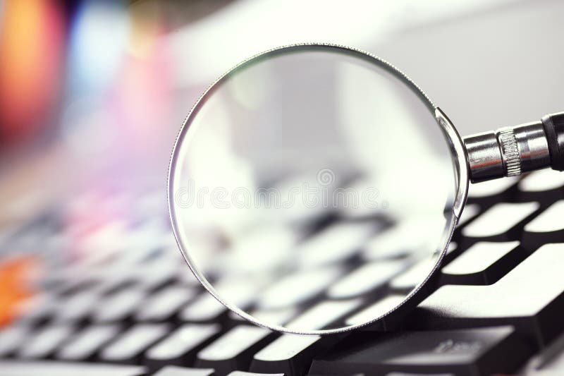 Magnifying Glass on the Keys of a Black Computer Keyboard Stock Photo ...