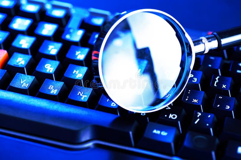 Magnifying Glass on the Keys of a Black Computer Keyboard Stock Photo ...