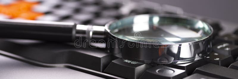 Magnifying Glass on the Keys of a Black Computer Keyboard Stock Photo ...