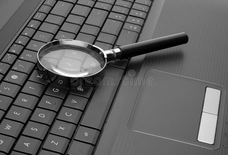Magnifying glass on laptop stock image. Image of magnification - 23858511
