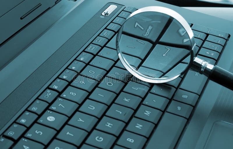 Laptop + Magnifying Glass stock photo. Image of search - 10910874
