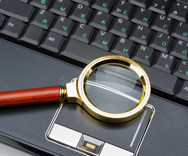 Laptop + Magnifying Glass stock photo. Image of search - 10910874