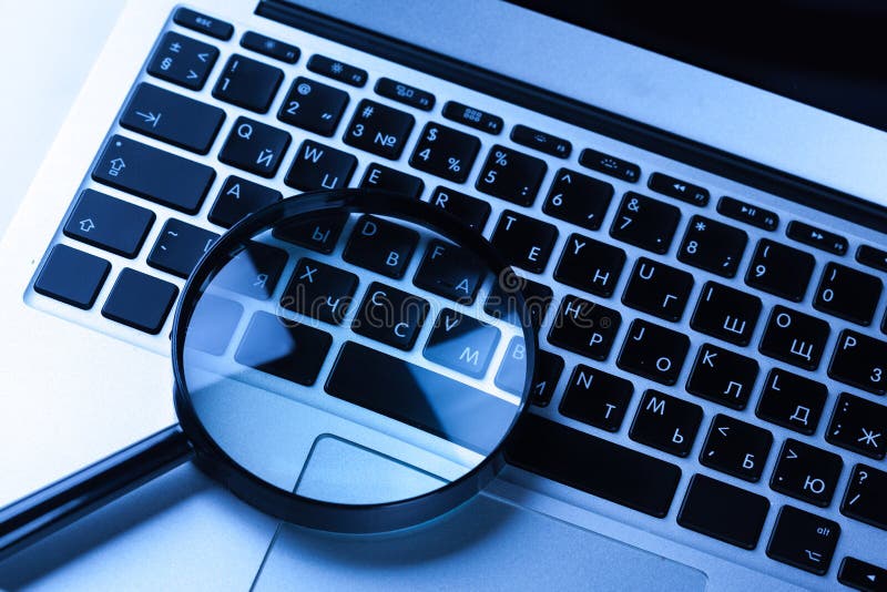 Magnifying glass on laptop stock photo. Image of glass - 75834706