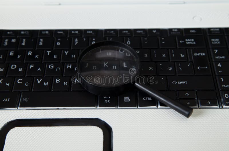 Magnifying Glass on a Laptop Keyboard Stock Image - Image of glass ...