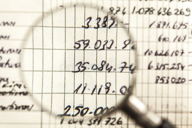 Magnifying Glass Looking at Financial Numbers Stock Photo - Image of ...