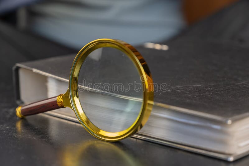 A Magnifying Glass Next To a Closed File Folder. Gray File Folder with ...