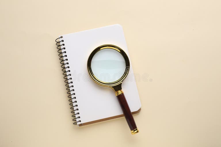 Magnifying Glass and Notebook on Beige Background, Top View Stock Image ...